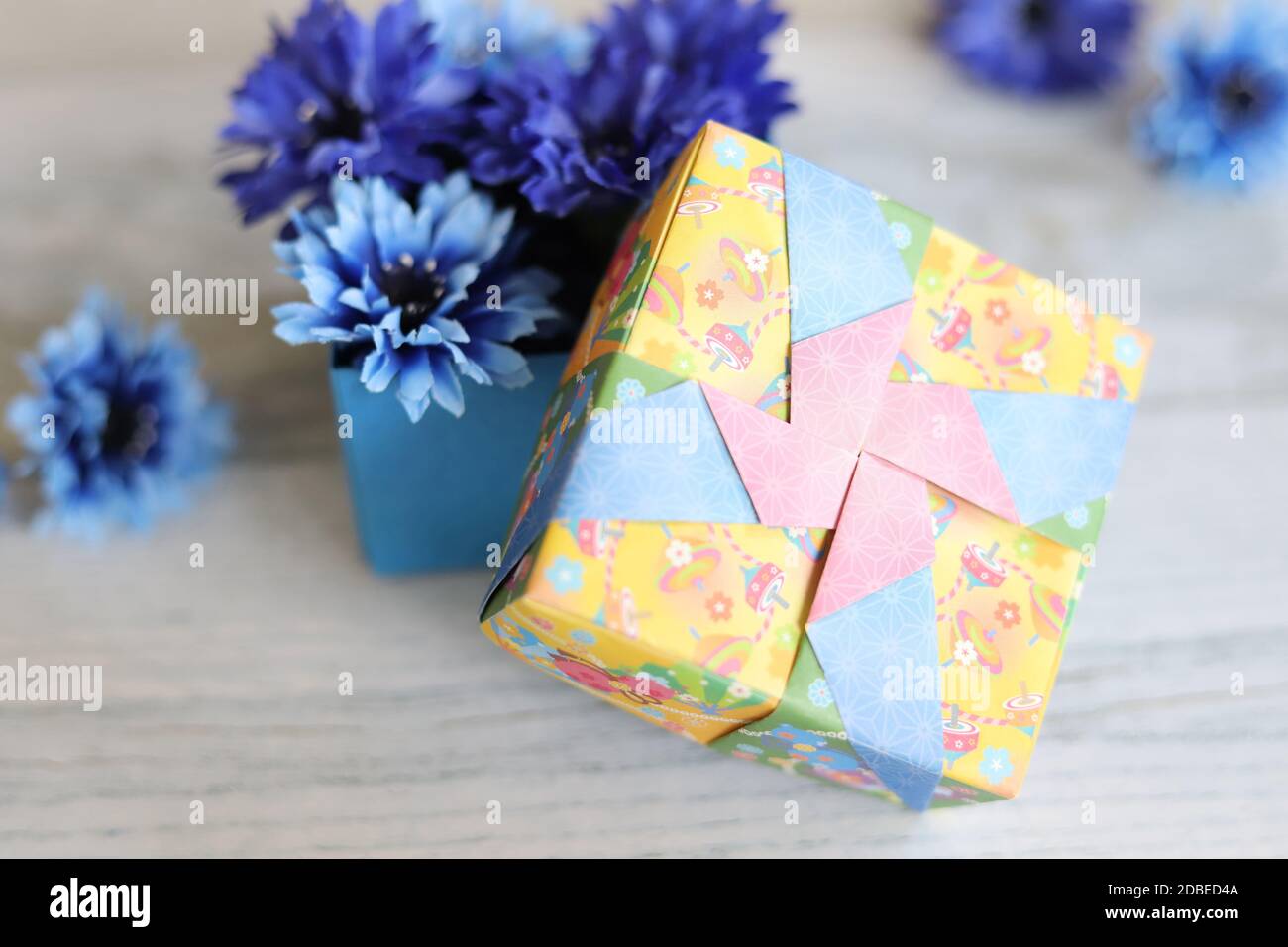 Colorful Japanese patterned square origami box with lid Stock Photo - Alamy