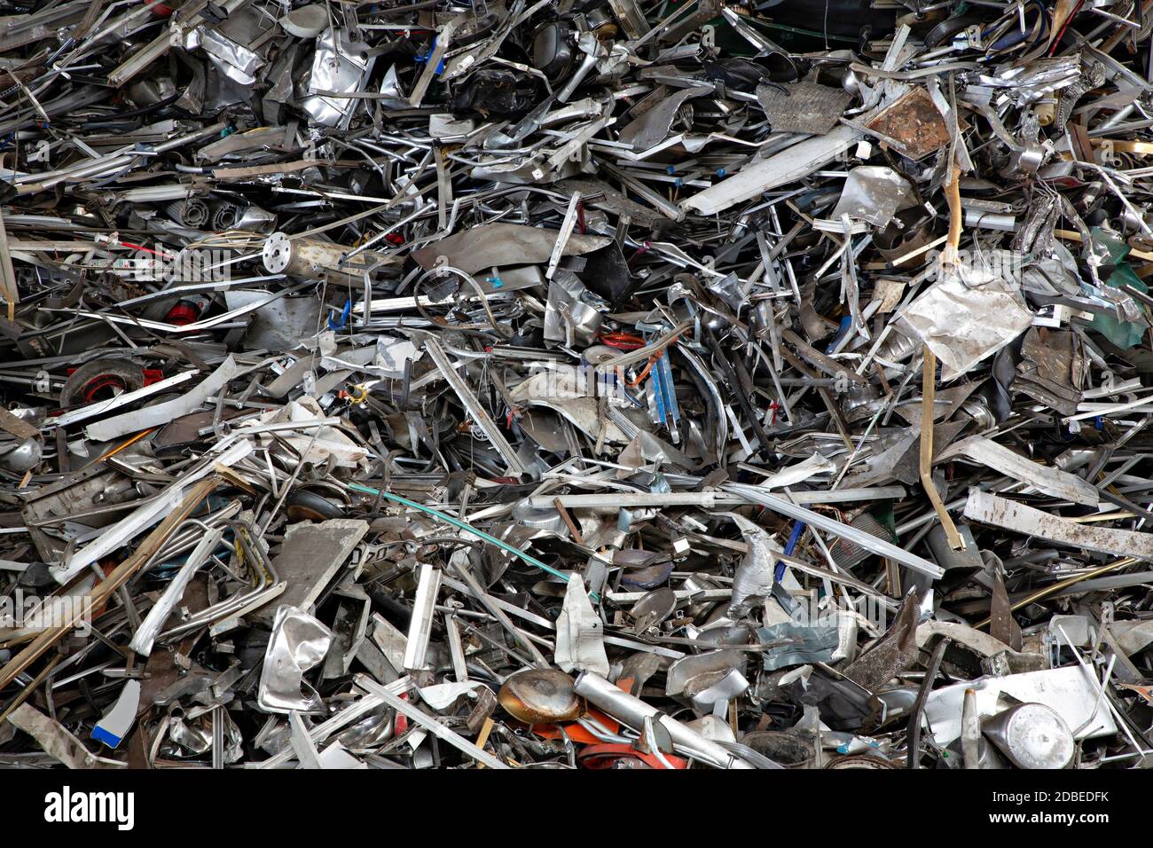 Used metal pieces on a scrap yard Stock Photo - Alamy