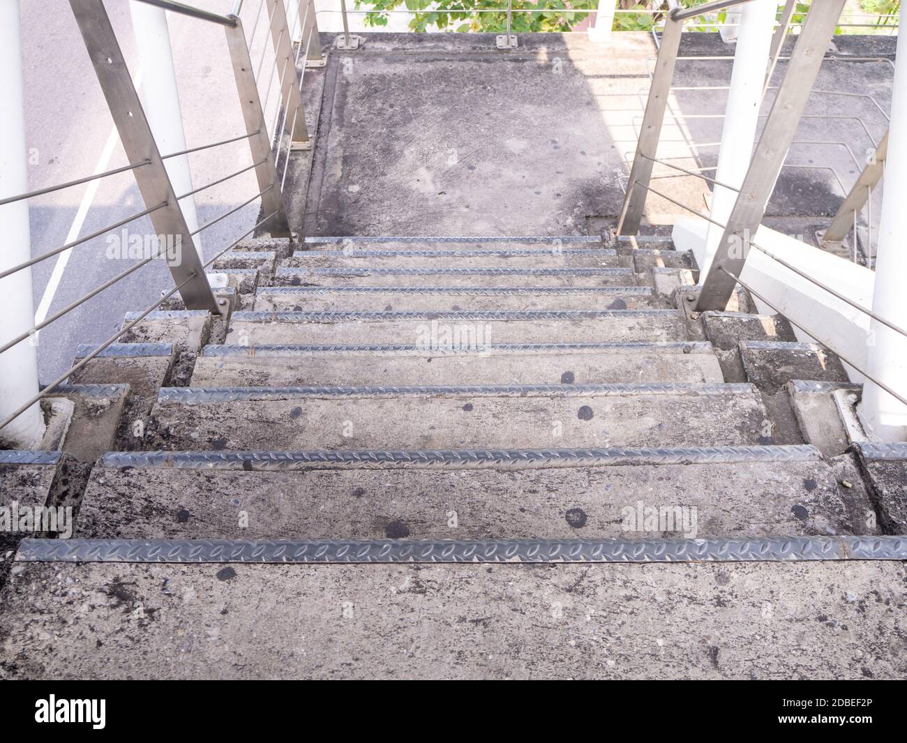 staircase for descending from footbridge. The concrete overpass for ...