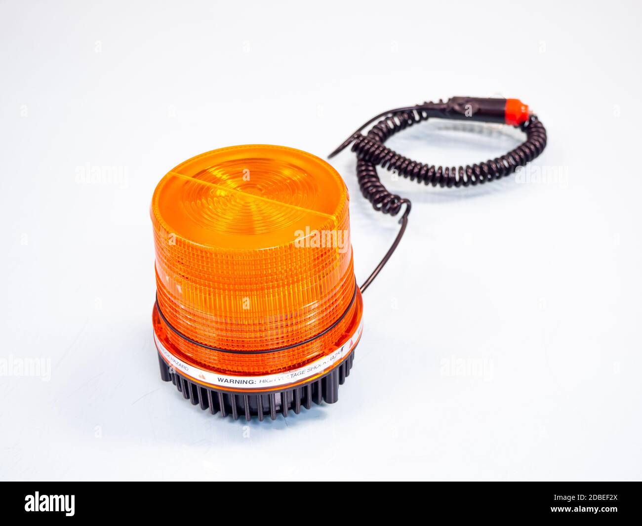 the Orange rotating beacon on white reflective background Stock Photo ...