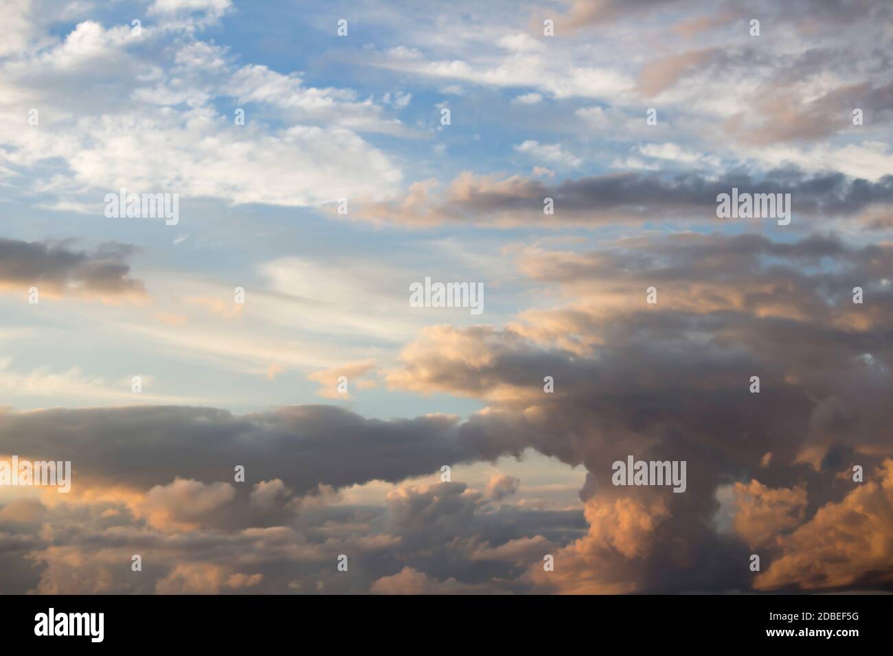 Dramatic big clouds in the vast sunset sky Stock Photo - Alamy