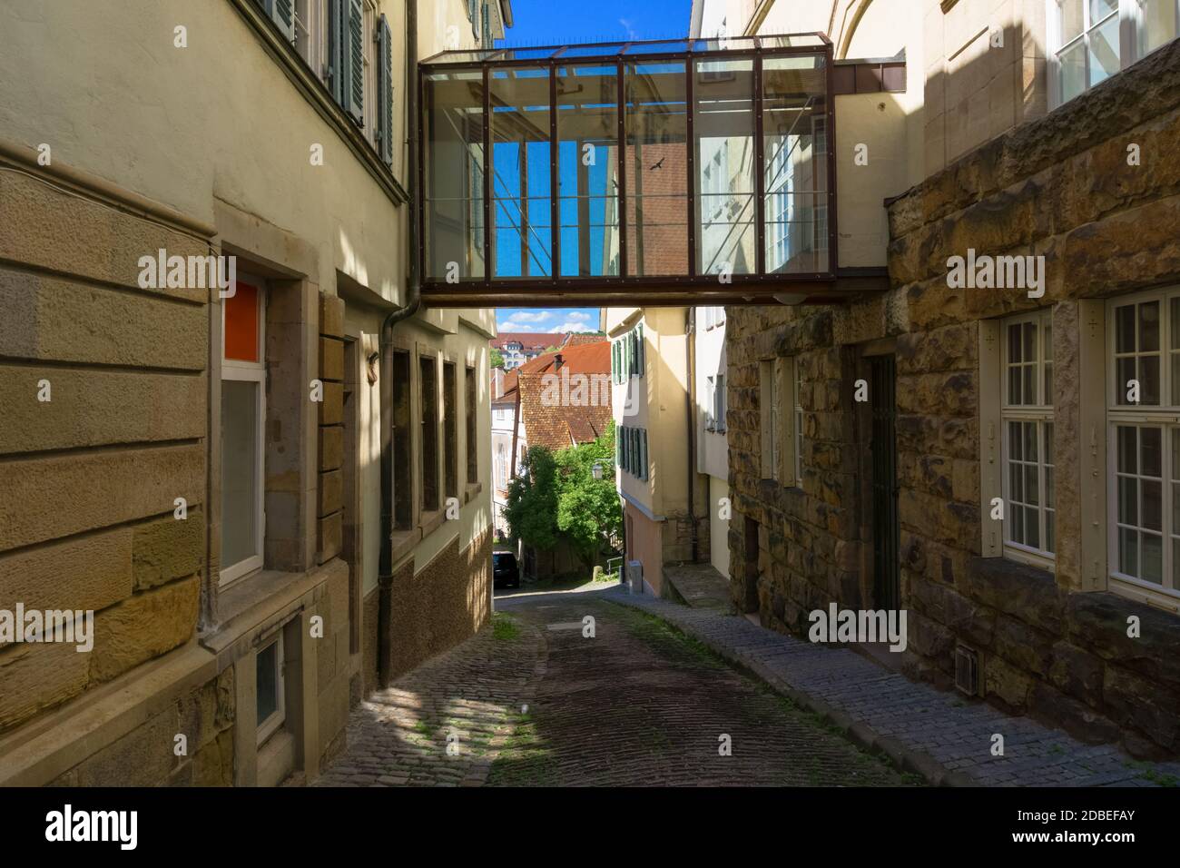 a connection between two buildings above the street Stock Photo - Alamy