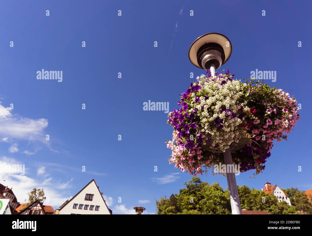 A bunch of colorful flowers on a lamp post Stock Photo - Alamy
