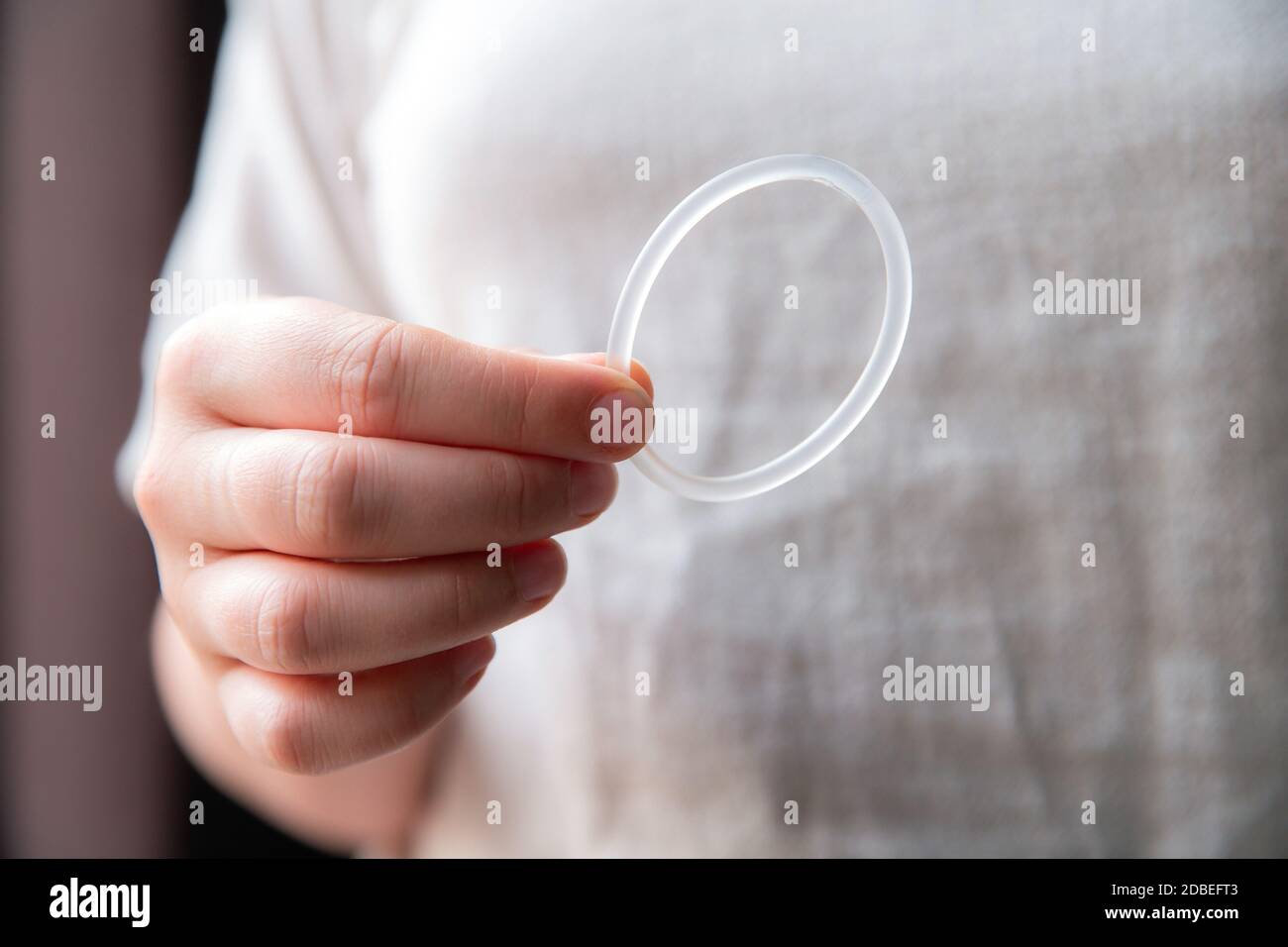 Woman's hand holding a birth control ring, vaginal ring for ...