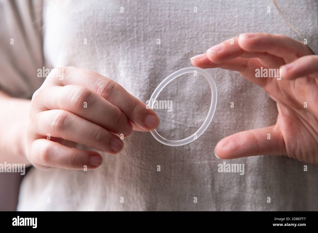 Woman's hand holding a birth control ring, vaginal ring for ...