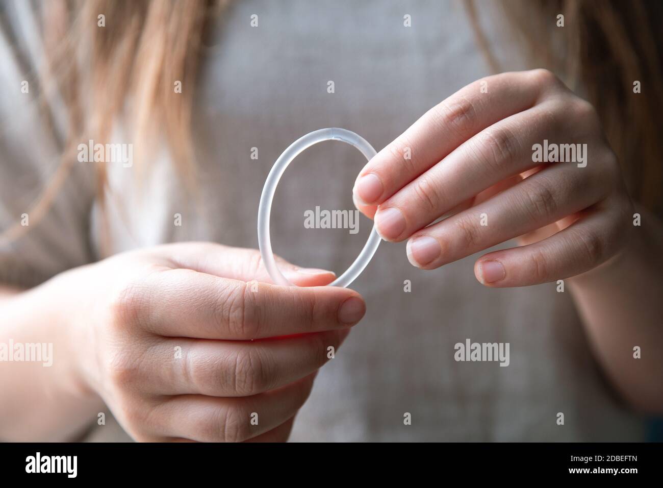 Woman's hand holding a birth control ring, vaginal ring for ...