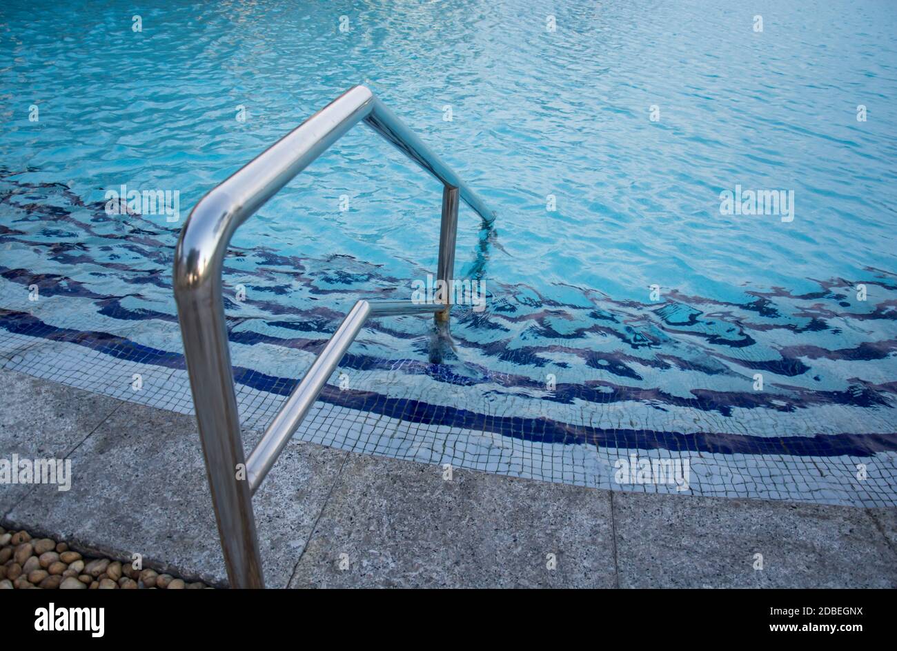 blue swimming pool with teak wood flooring stripes summer vacation ...