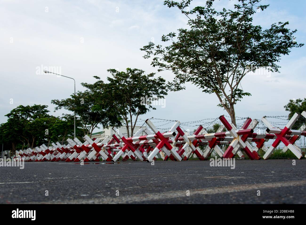 Barbed wire fence block the way Stock Photo - Alamy