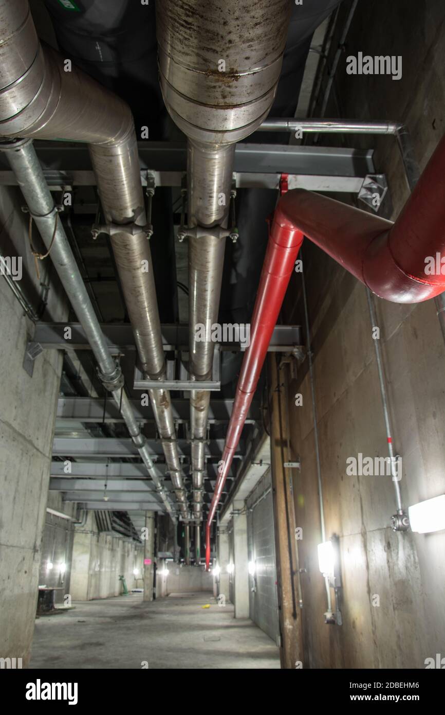 Big pipe under the building underground Stock Photo - Alamy