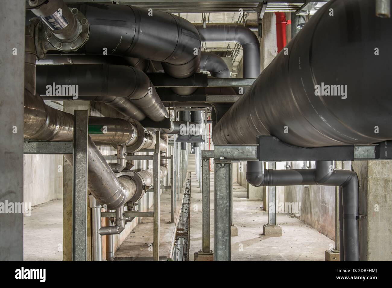Big pipe under the building underground Stock Photo - Alamy