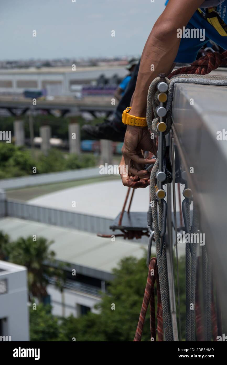 workers cleaning windows service on high rise building Stock Photo - Alamy