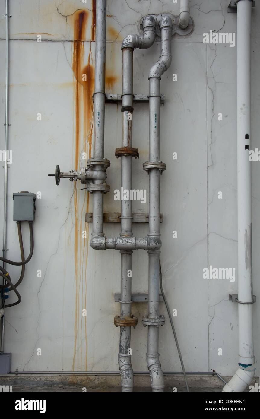 grunge iron pipeline and plumbing connection joints with industrial tap ...