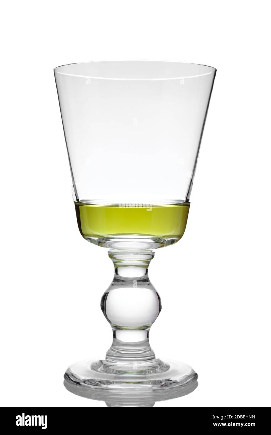 Neat green absinthe drink alcolzol in a glass Stock Photo - Alamy