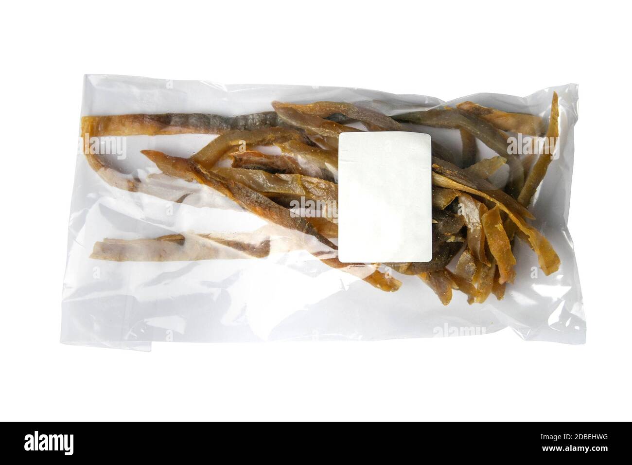 Dried carp fish sticks in a transparent package with a white label ...