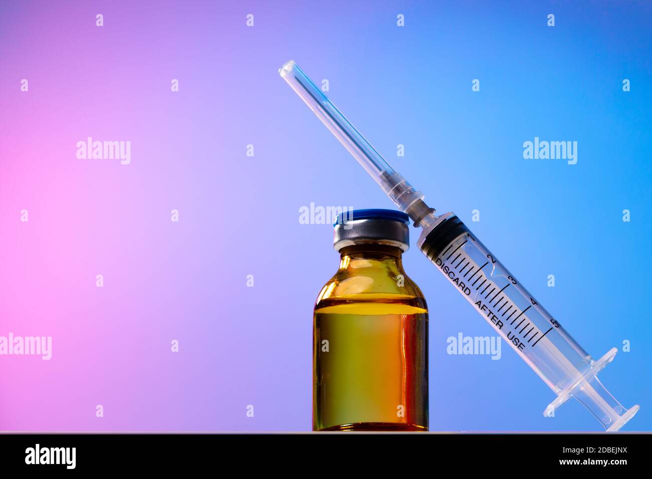 Medical vial with medication and syringe close up Stock Photo - Alamy