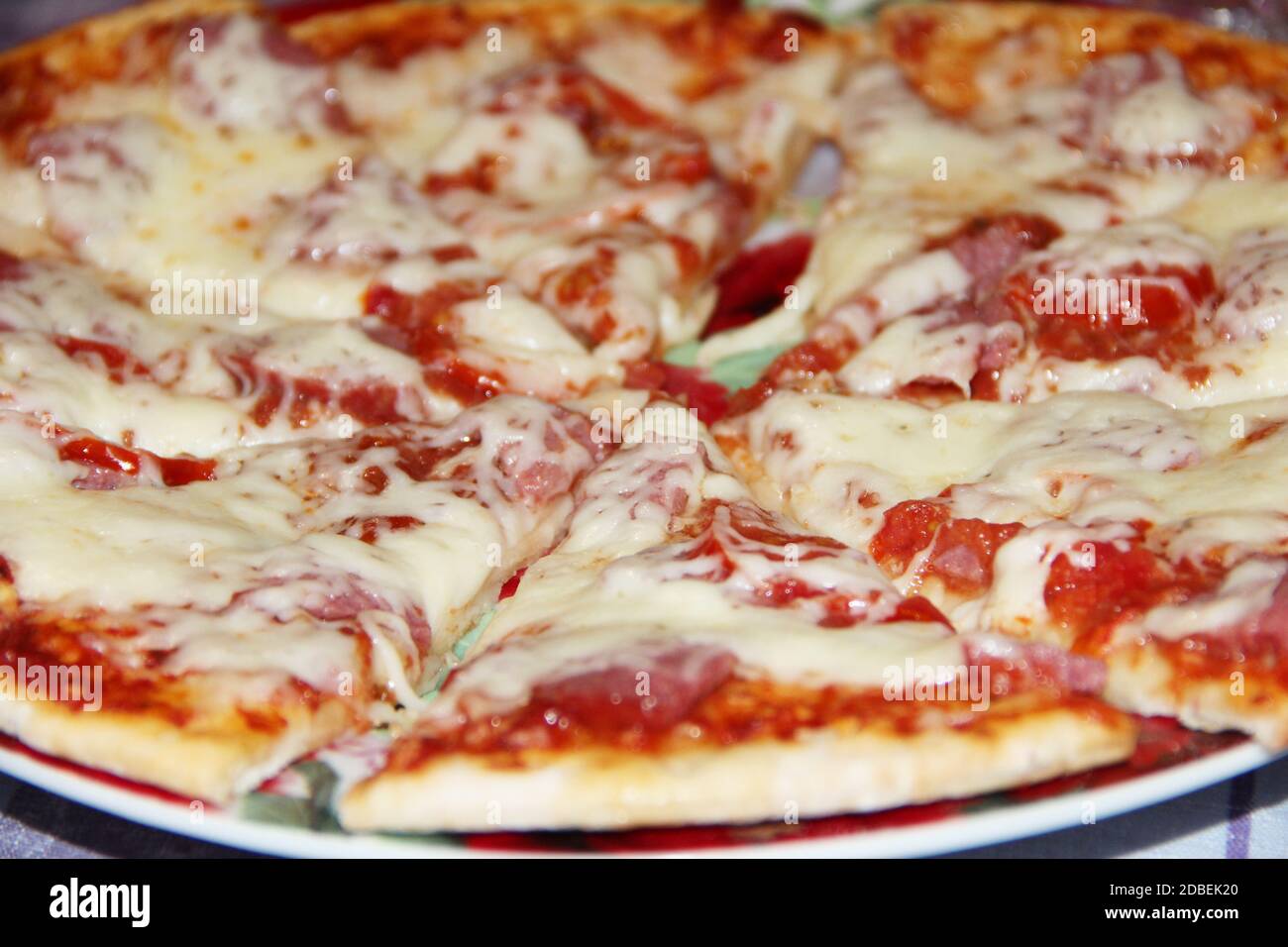 Pieces of fresh appetizing pizza with delicious ingredients close up ...