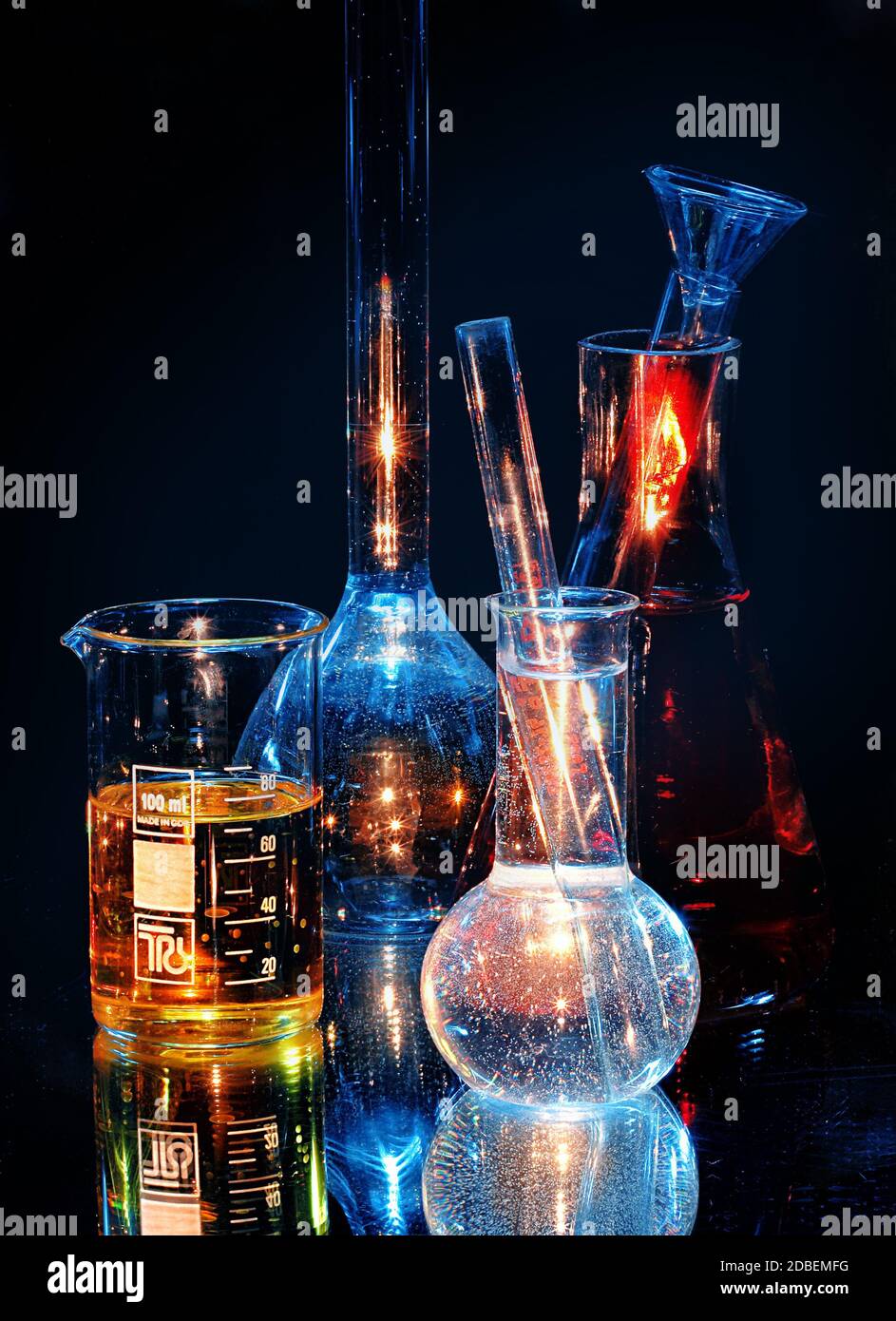 Chemical glassware with rack close-up on blue background Stock Photo ...