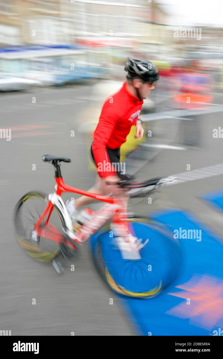 Competitors entering the transition area after the bike ride in the ...