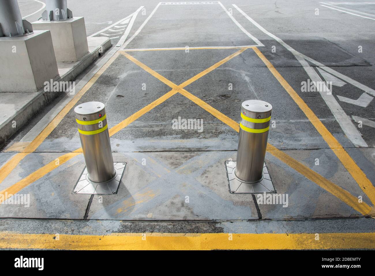 bollards with Security at the gate Stock Photo - Alamy