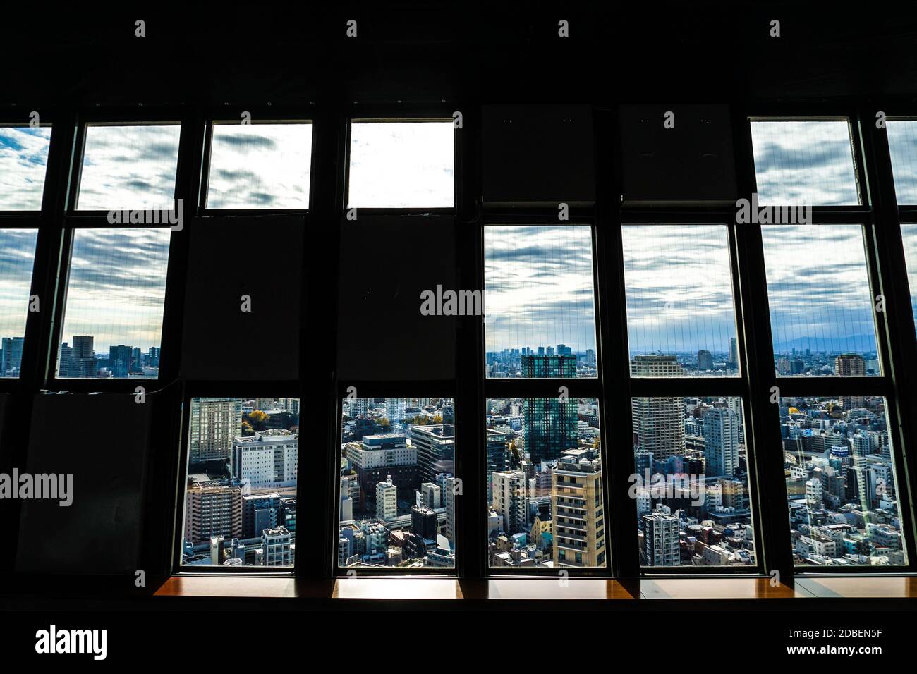 Tokyo skyline visible to the Tokyo Tower Observatory through a window ...