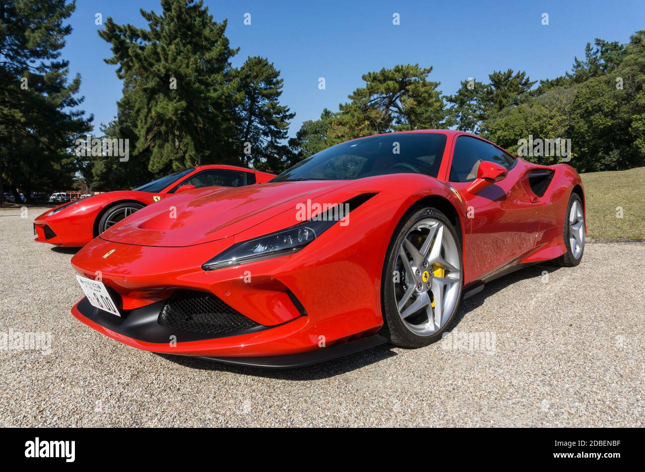 A rosso red Ferrari F8 Tributo in the autumn sunshine in Nara, Japan ...