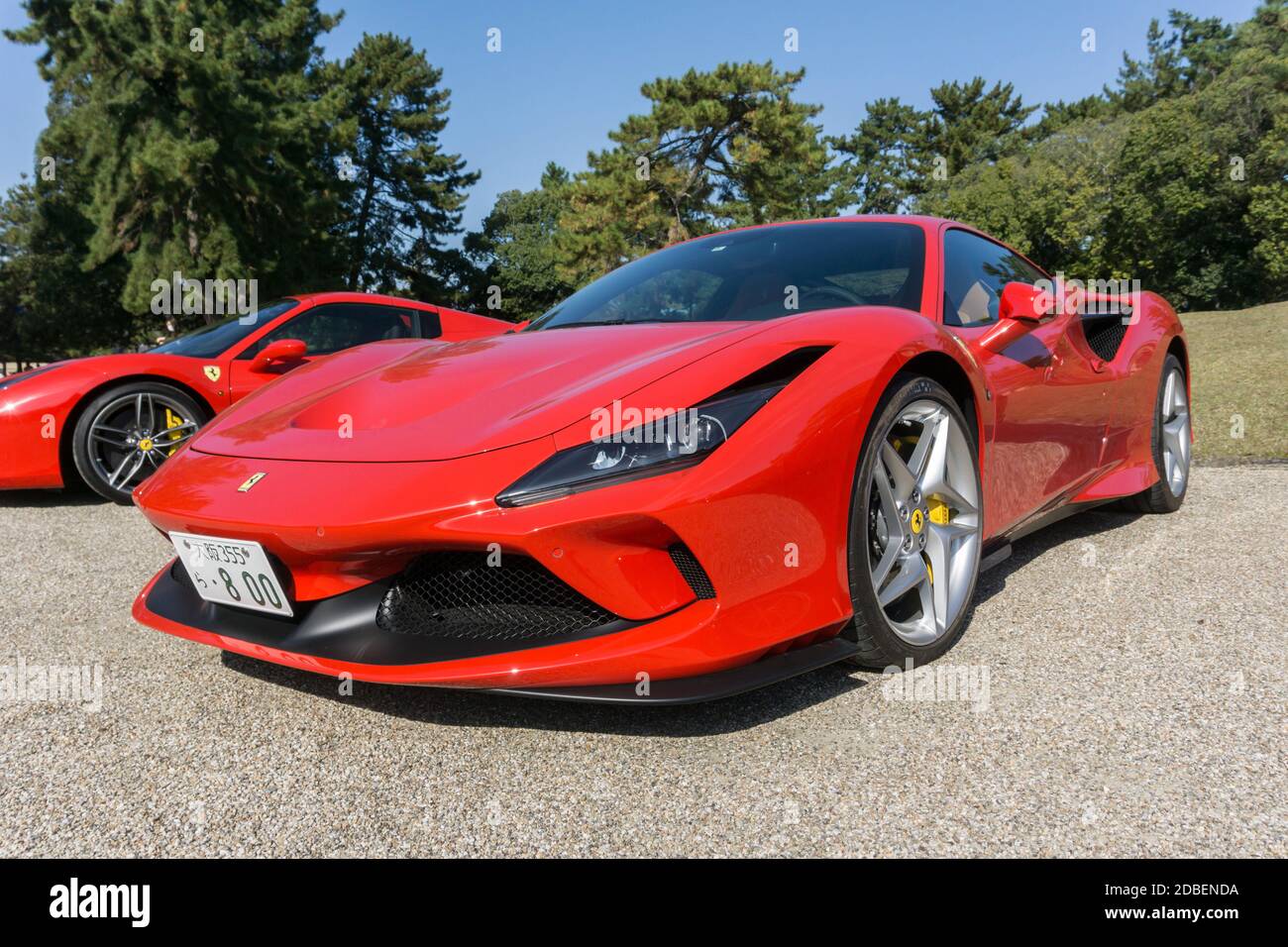 A rosso red Ferrari F8 Tributo in the autumn sunshine in Nara, Japan Stock Photo - Alamy