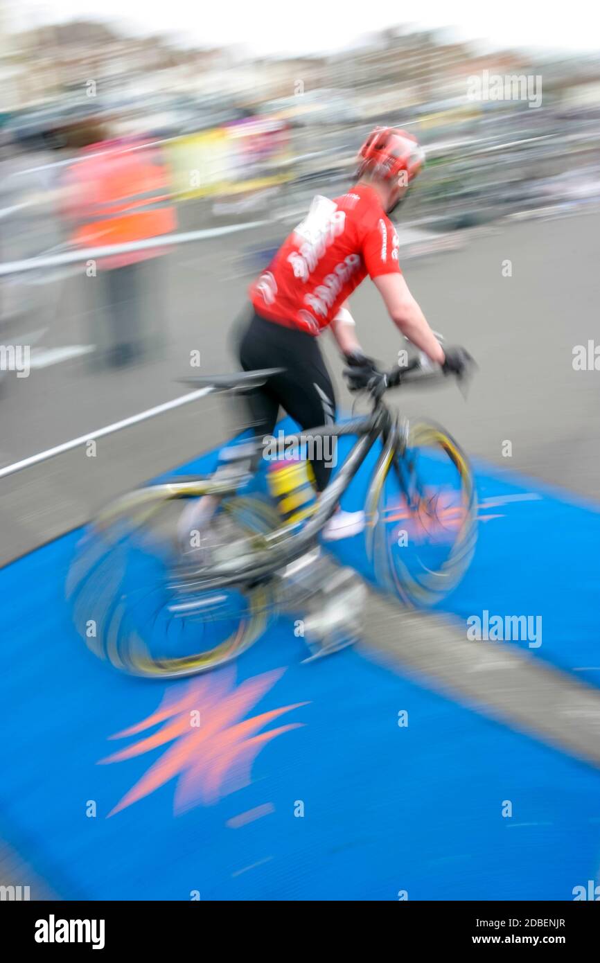 Competitors entering the transition area after the bike ride in the ...
