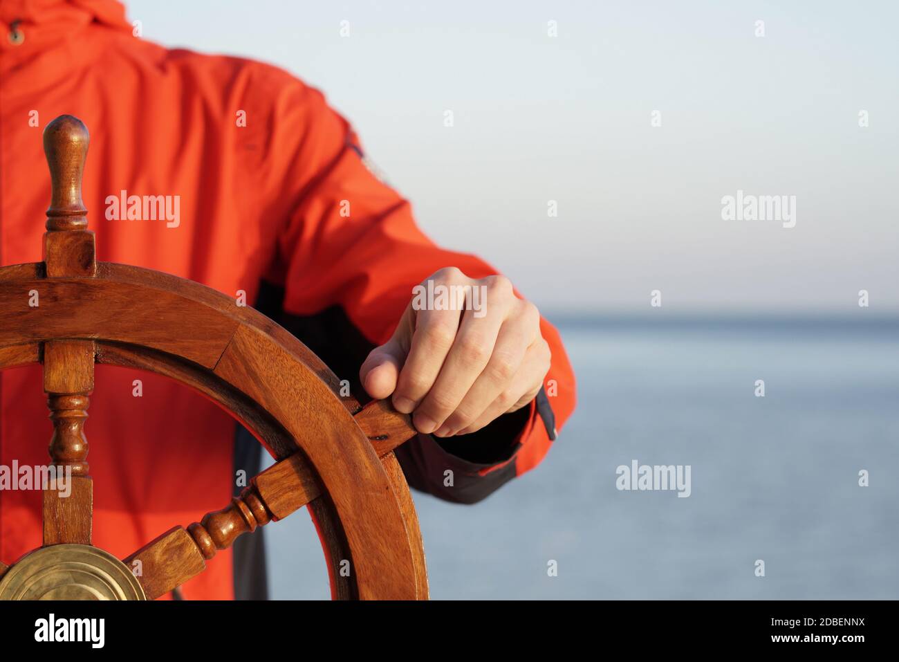 Hand on ship rudder Stock Photo - Alamy