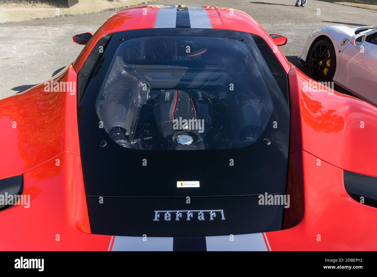 View of the engine bay of a rosso corsa Ferrari 488 Pista outdoors in ...
