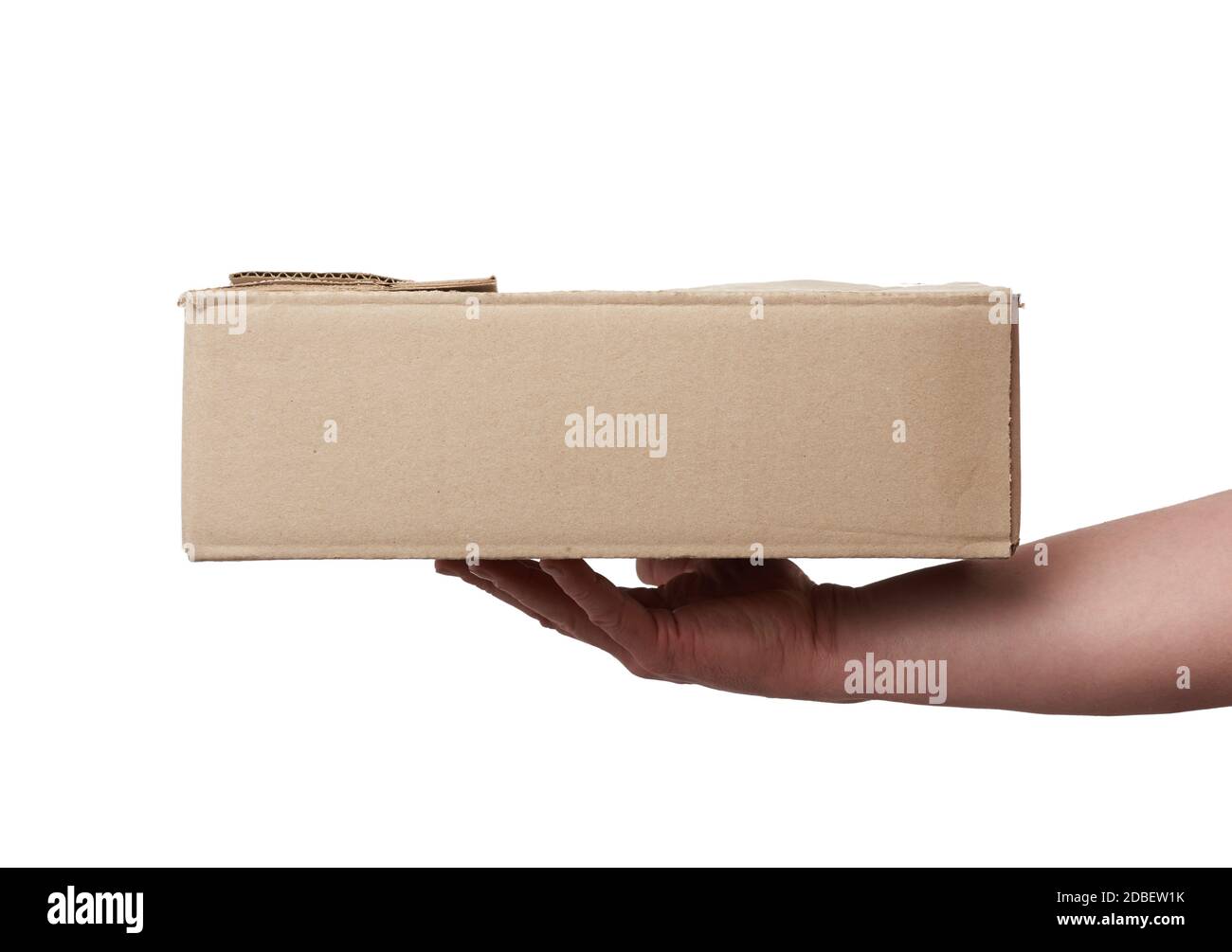 hand holds a brown cardboard box of paper on a white isolated ...