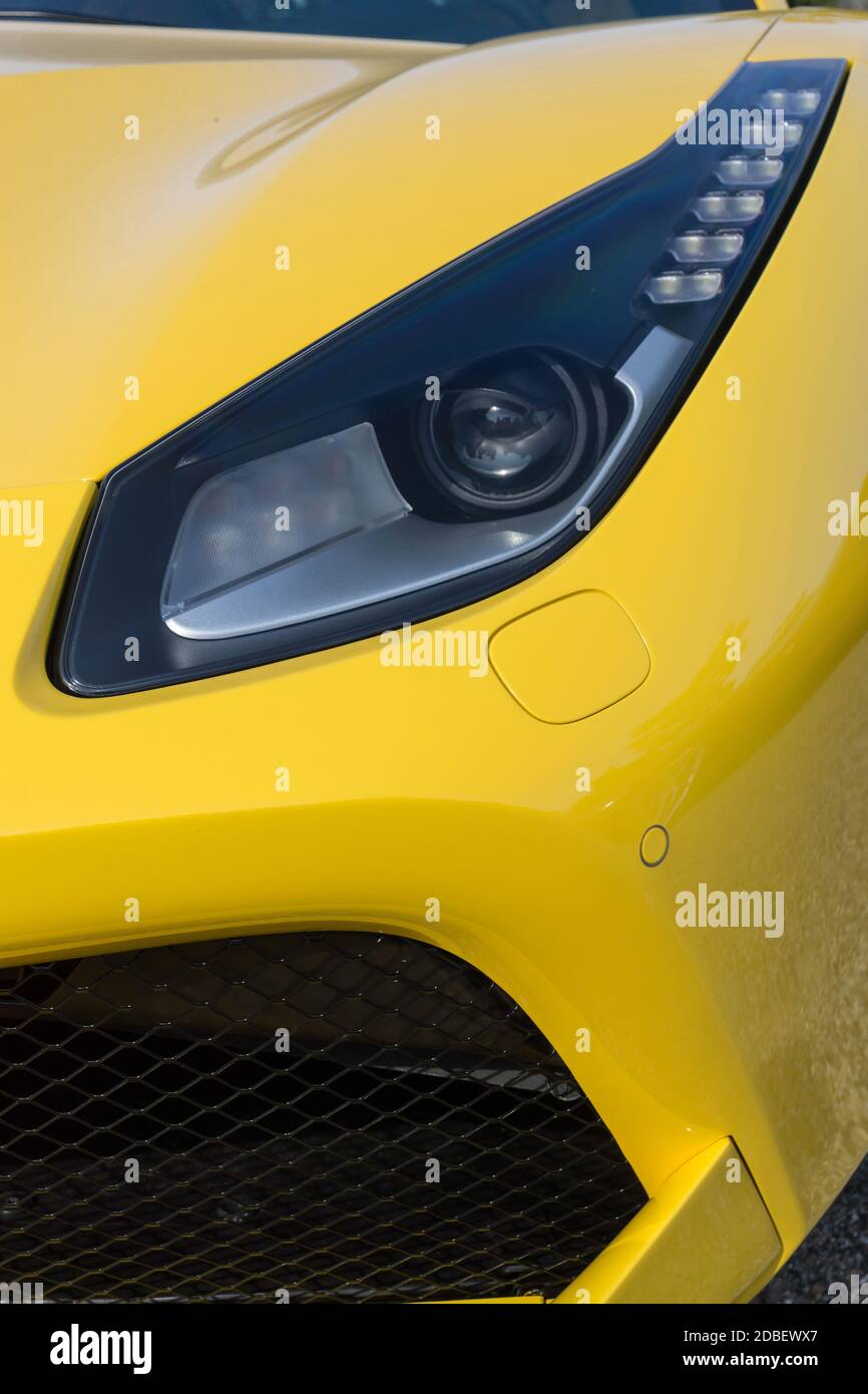 Close up of front left headlight on a yellow Ferrari 488 GTB Stock ...