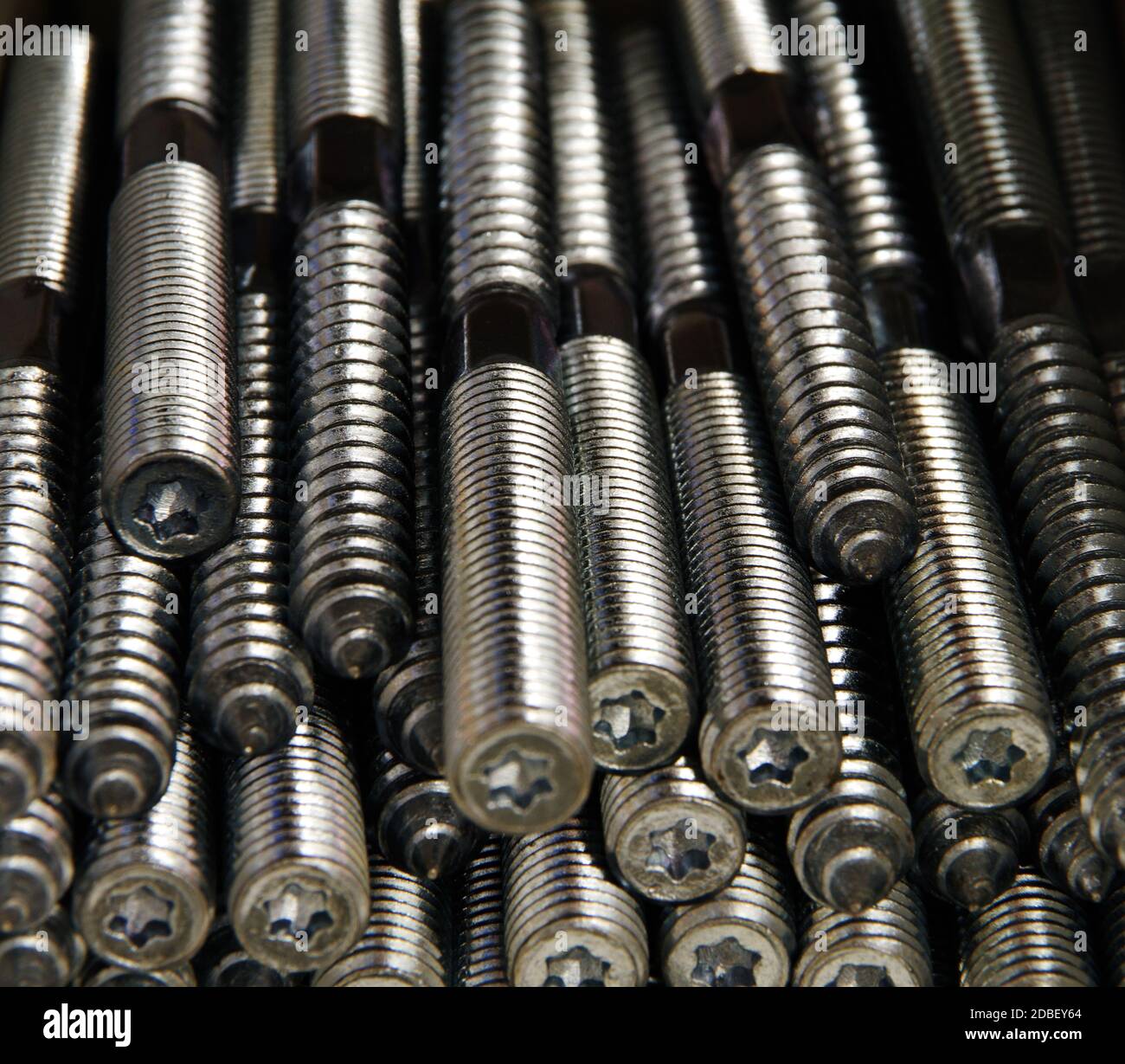 Galvanized hanger bolts in hard side light Stock Photo - Alamy