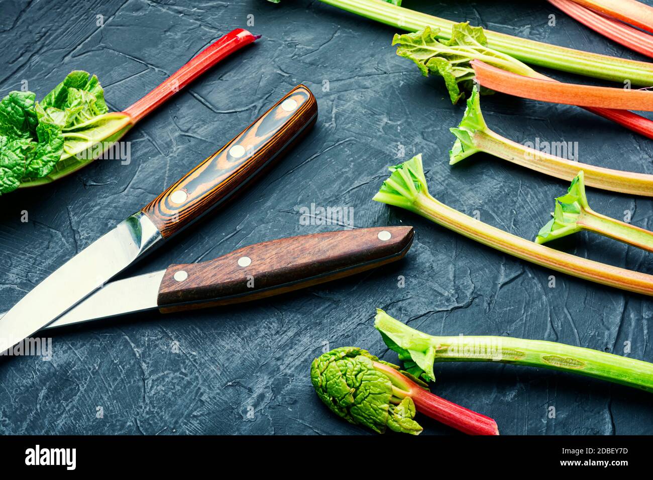 Fresh red rhubarb stalks with green leaves.Fresh rhubarb stem Stock ...