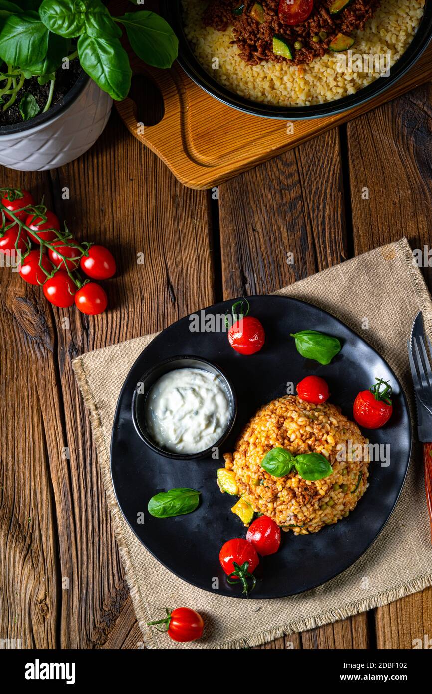 rustic bulgur fried with minced meat and vegetables Stock Photo - Alamy