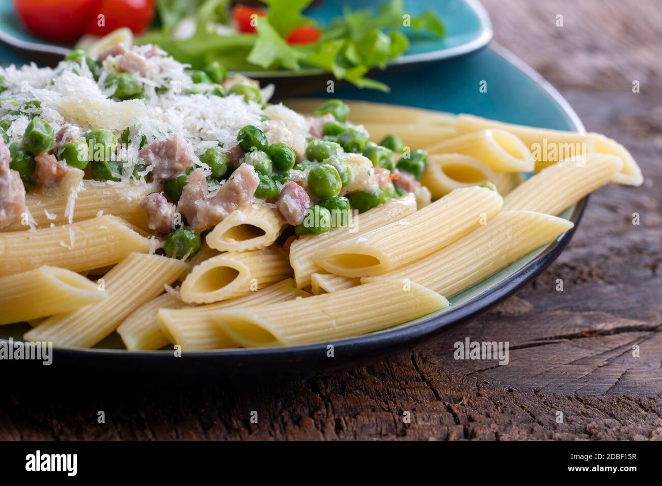 rigatoni emiliana on dark rustic wood Stock Photo - Alamy
