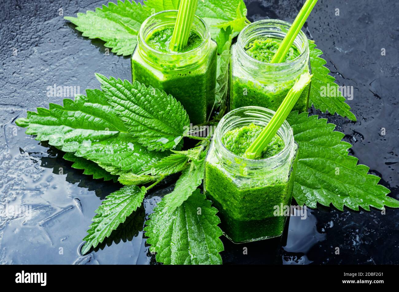 Green smoothie from nettle leaves in glass jars.Fresh smoothies Stock ...