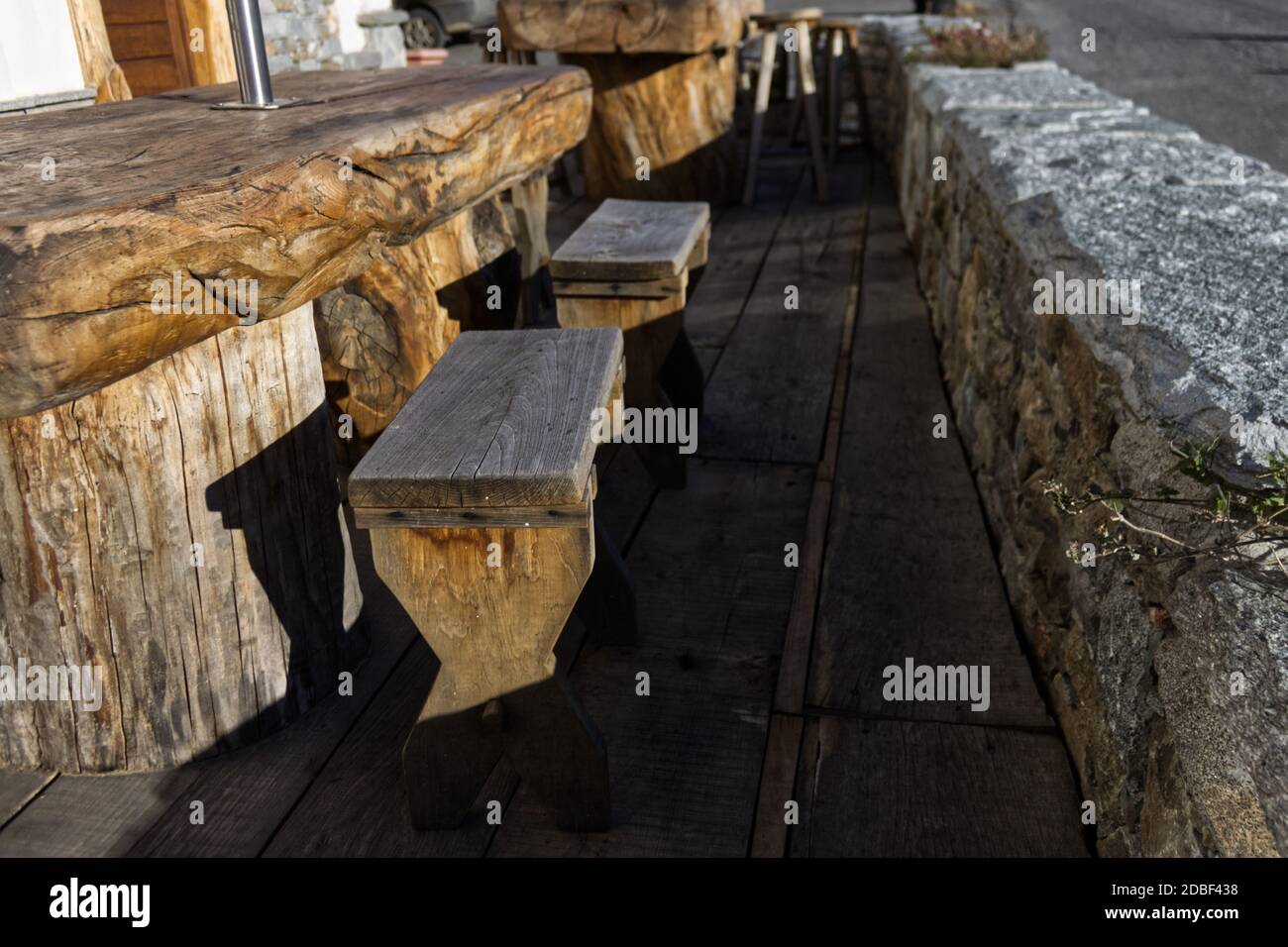 Typical Italian alpine landscape: benches and tables carved from a ...