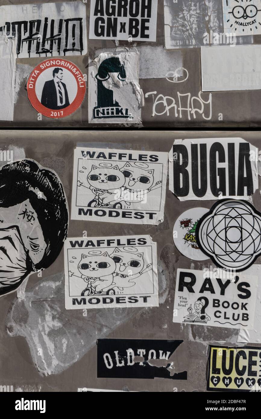 Old stickers on an electrical box in a street in Osaka, Japan Stock ...