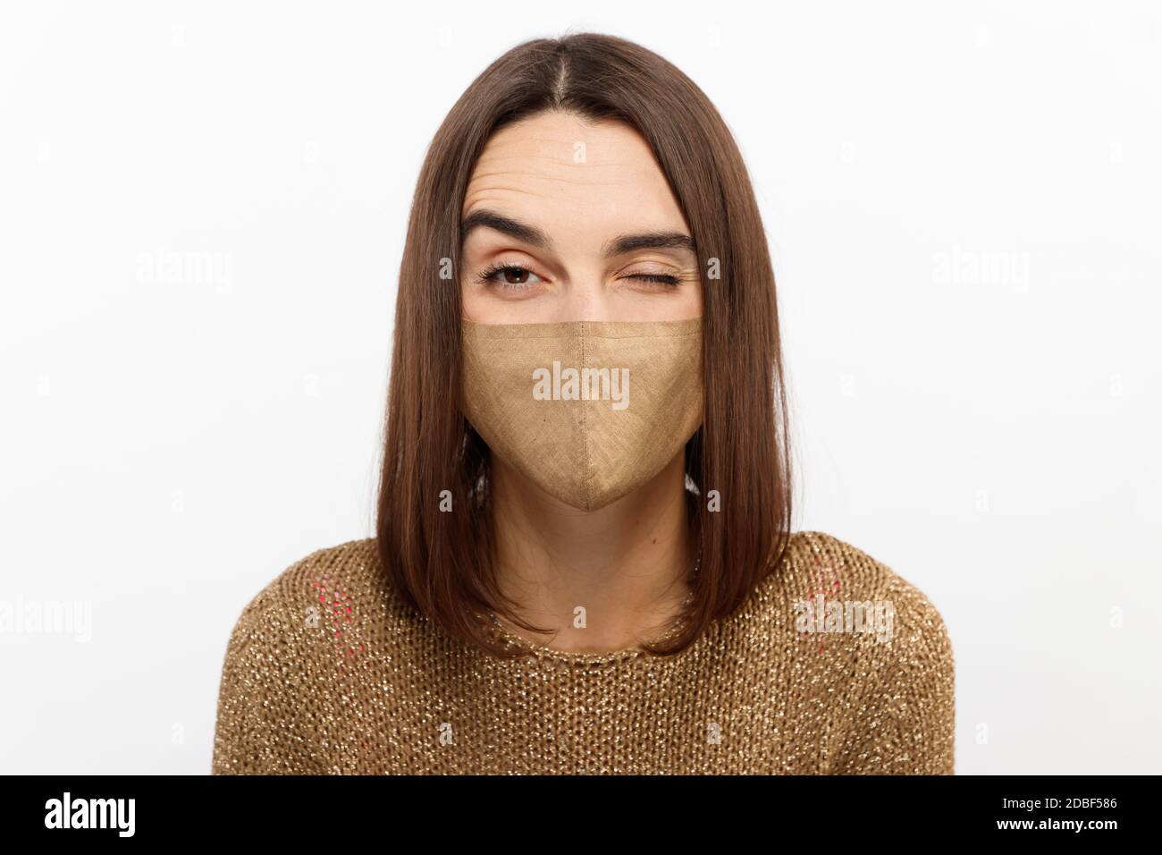 Photo of flirty young girl blink eye look camera wear face mask ...