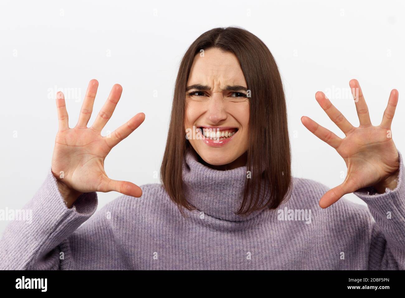 Serious pretty woman making stop hand sign palm gesture, Stay away and ...