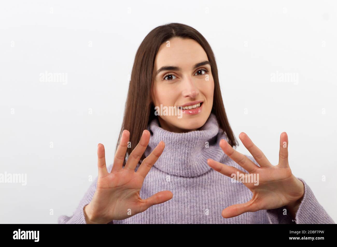 Serious pretty woman making stop hand sign palm gesture, Stay away and ...