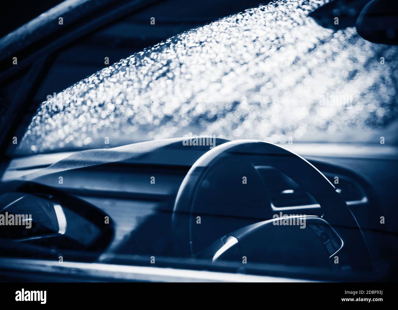The passenger compartment in the car in a dark rainy weather. Rain is ...