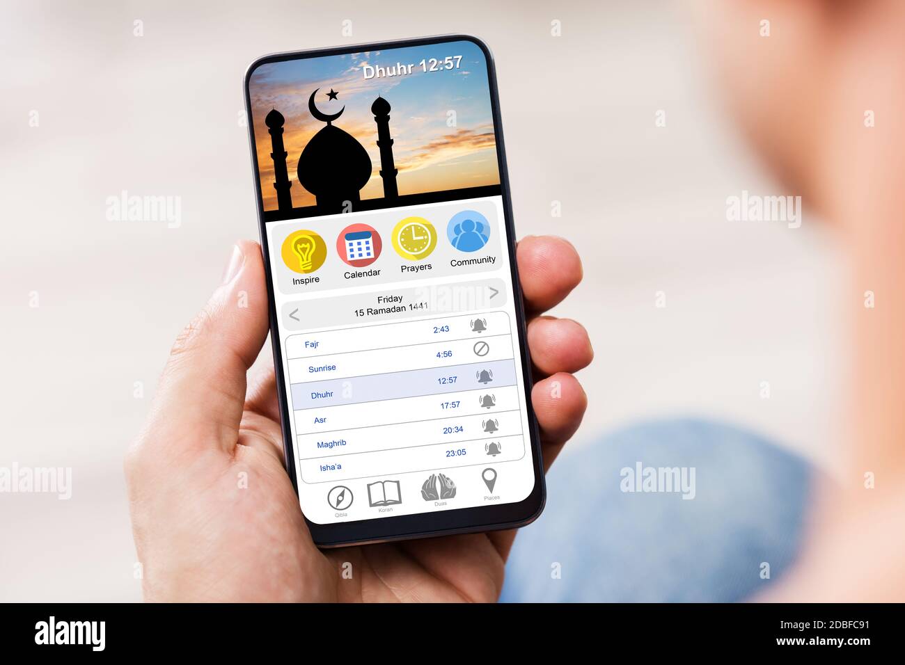 Man Using Muslim Prayer App On Mobile Phone Stock Photo - Alamy