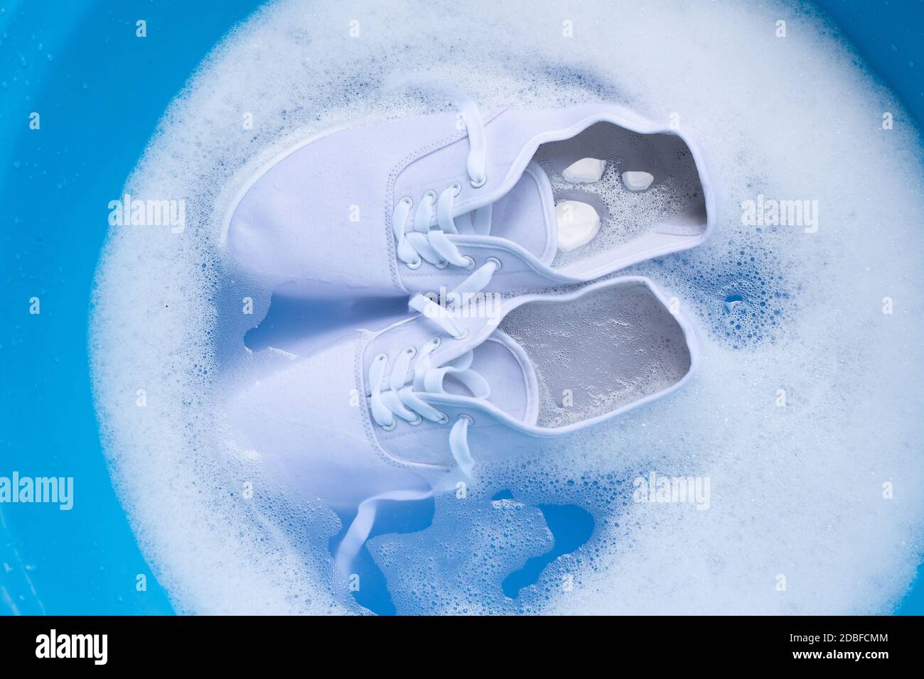 Soak shoes in powder detergent water dissolution before washing ...