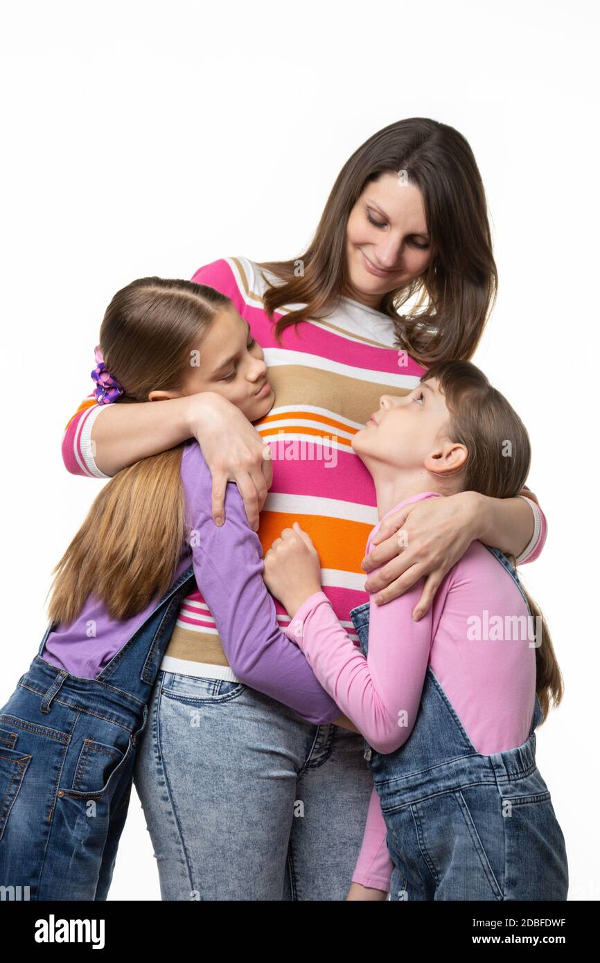 Children joyfully hug mom, isolated on white background Stock Photo - Alamy