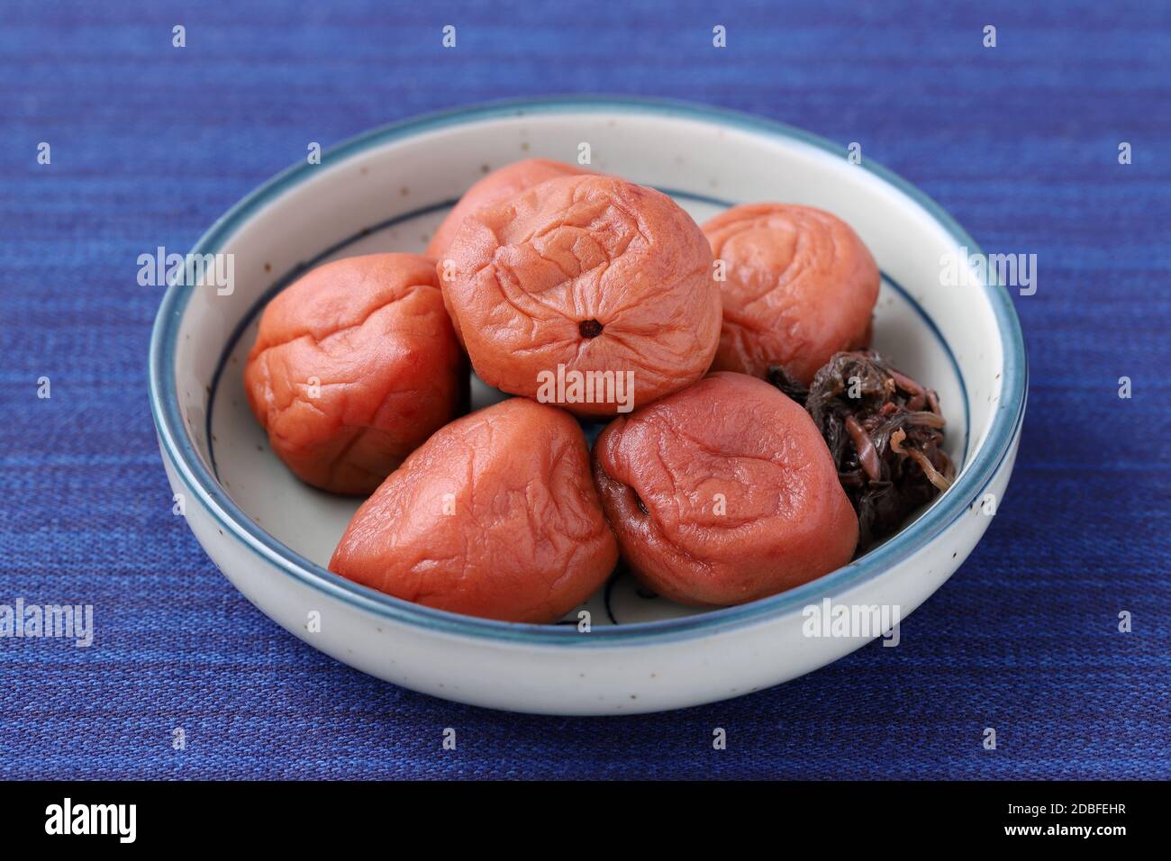 Japanese food, pickled Umeboshi in a dish on table Stock Photo - Alamy
