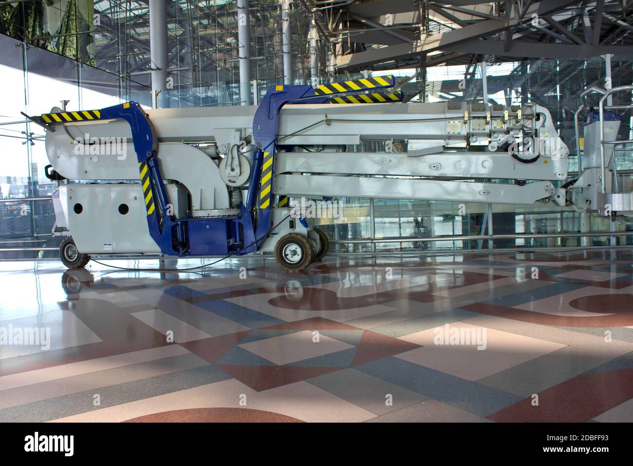 Blue elevator in airport building Stock Photo - Alamy