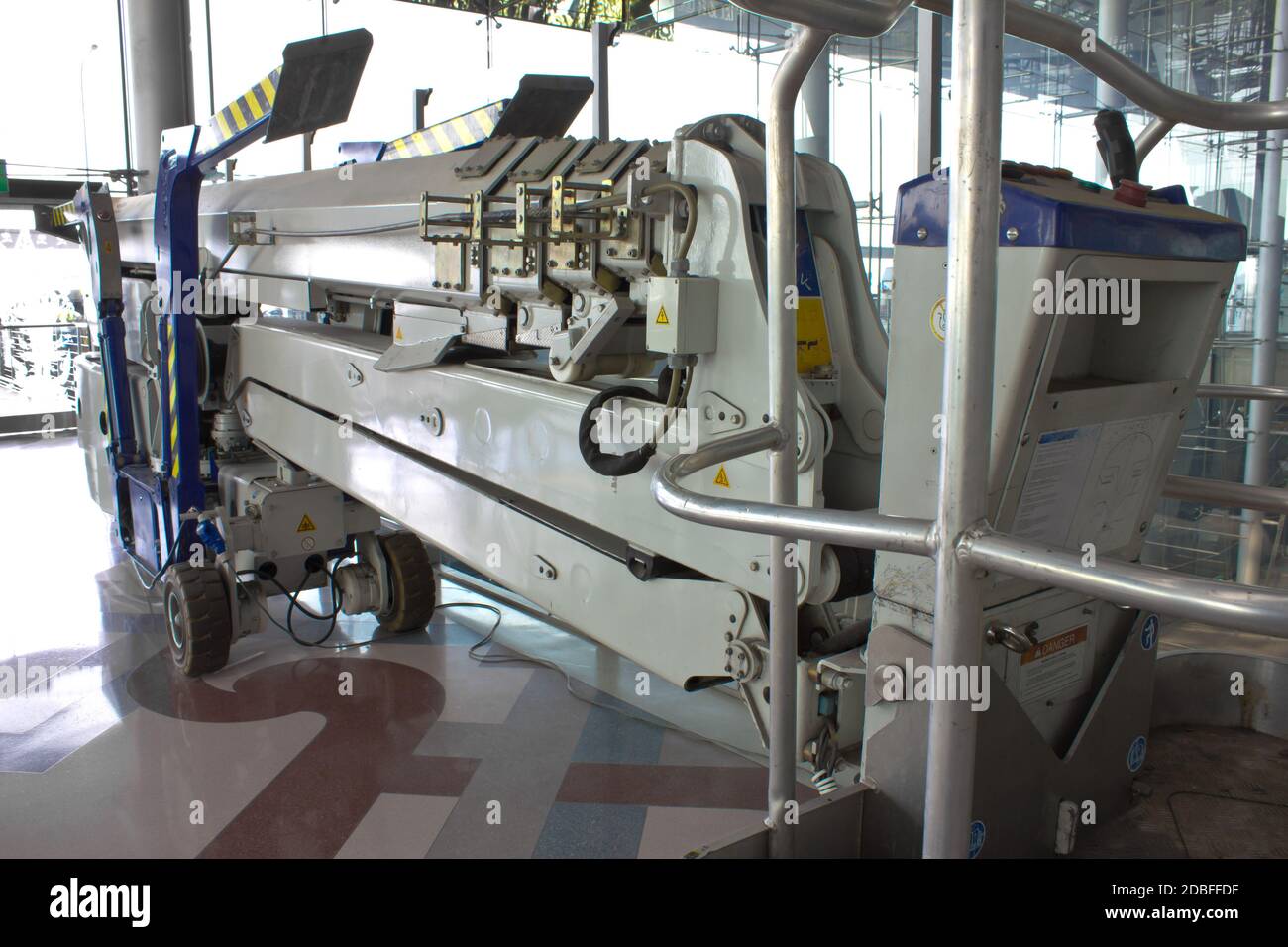 Blue elevator in airport building Stock Photo - Alamy