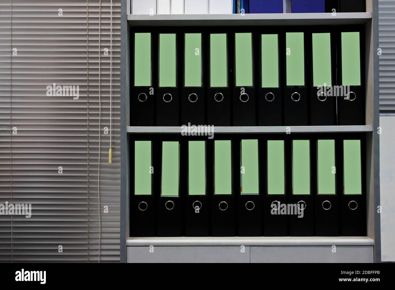 File folders standing on the shelves at office Stock Photo - Alamy