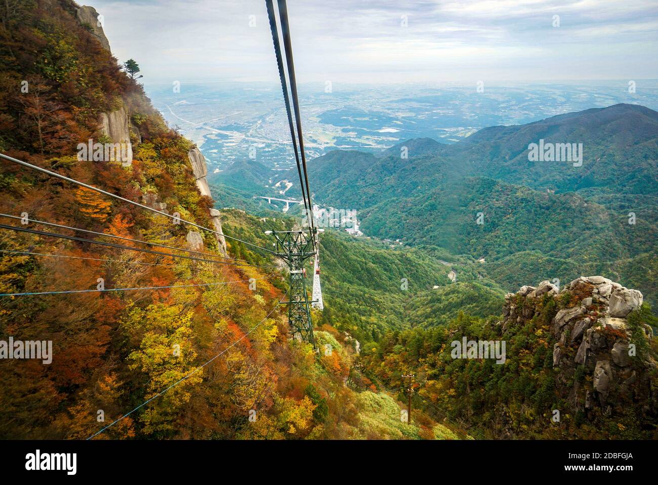 The Gozaisho Ropeway (a Japanese aerial lift line), the line climbs ...